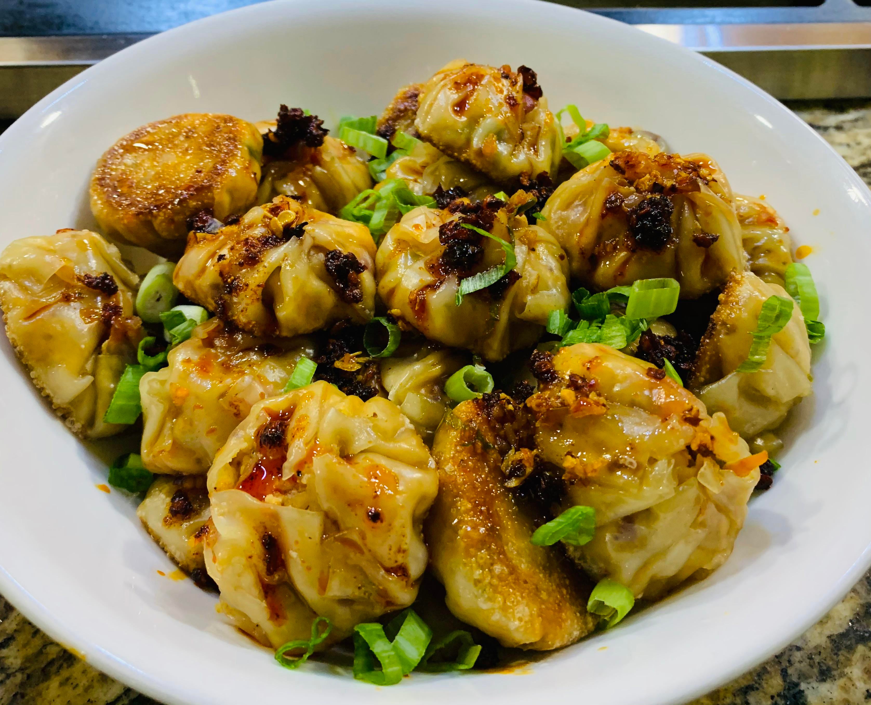 Girlfriend made some chili oil momos with ghost pepper flakes - Chili Chili